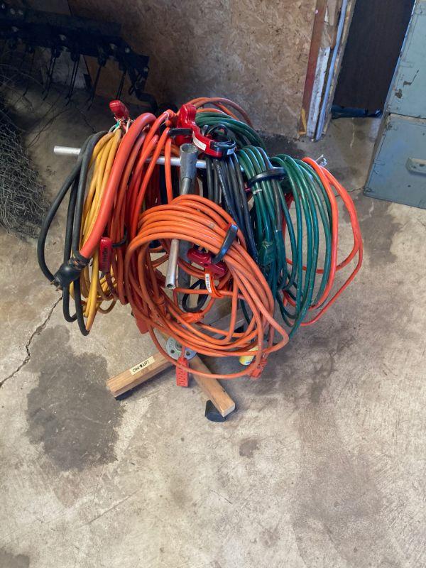 Lot of extension cords/rack | EstateSales.org