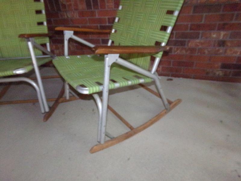 LOT 85 TWO WEBBED PATIO ROCKING CHAIRS | EstateSales.org