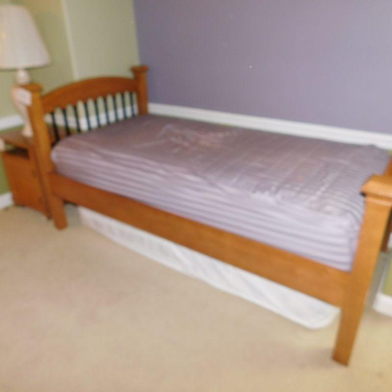 Lot 110. twin bed with second mattress below | EstateSales.org