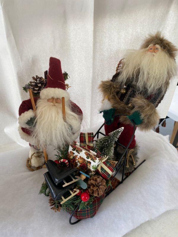 Lot #598 Christmas Santas pushing Sled | EstateSales.org