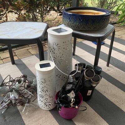 Misc outdoor patio decor with side tables | EstateSales.org