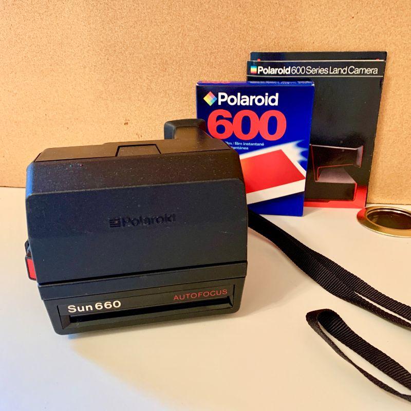 LOT 100 VINTAGE POLOROID SUN 600 CAMERA BOOK & FILM | EstateSales.org