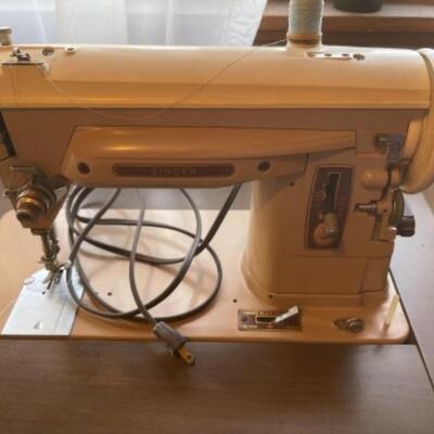 Lot 132. Singer sewing machine in table with attachments--$55 ...