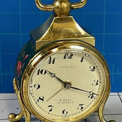 Lot #309 Turler 15 jewel enamel and brass Clock | EstateSales.org