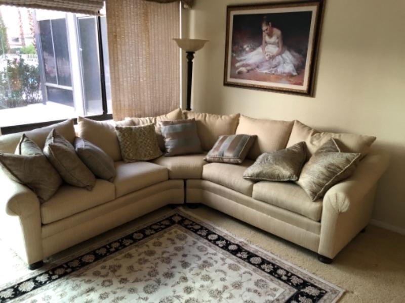 Lot 49. Two-piece cream colored sectional sofa with pillows--$125 ...