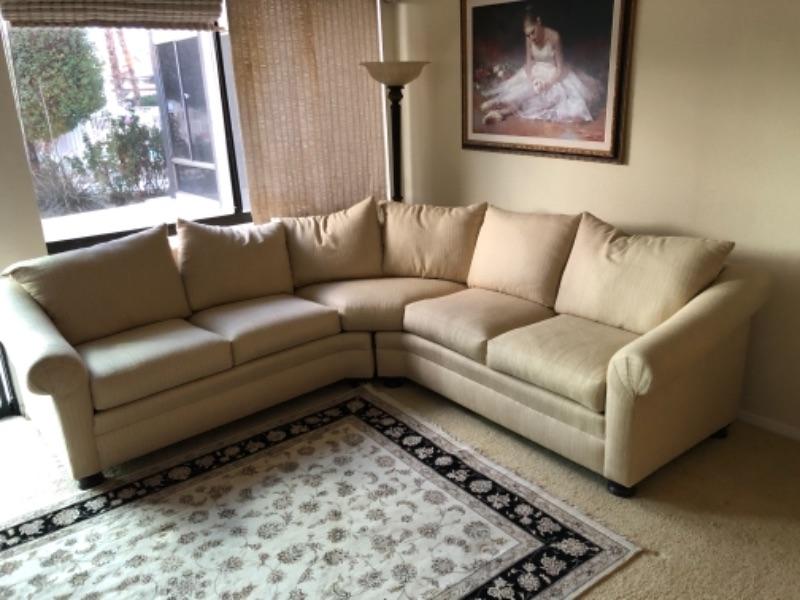 Lot 49. Two-piece cream colored sectional sofa with pillows--$125 ...