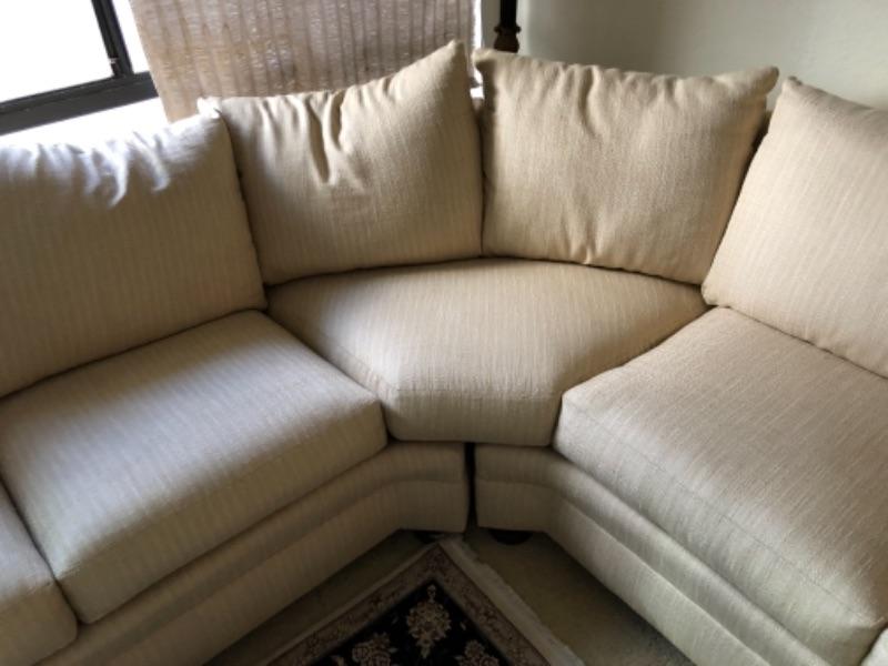 Lot 49. Two-piece cream colored sectional sofa with pillows--$125 ...