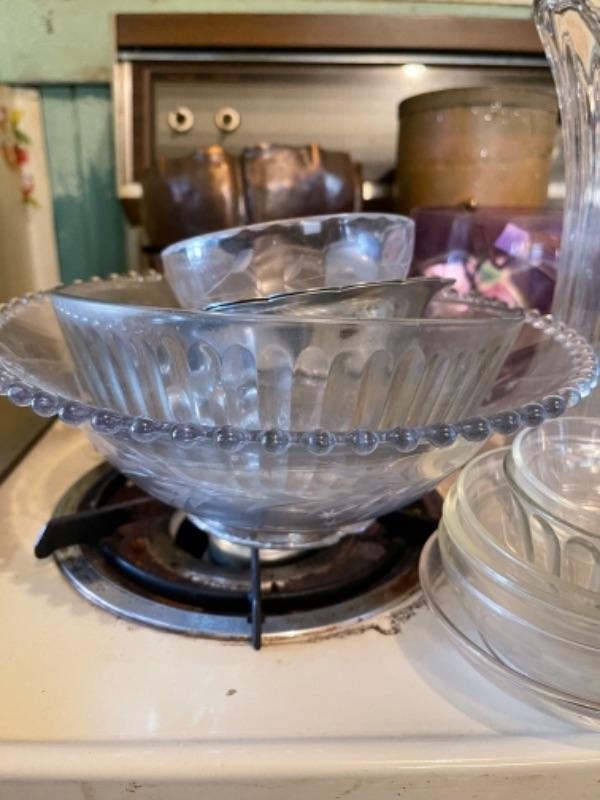 Lot 60K. Large assortment of glass kitchenware—coasters, cruets, vases ...