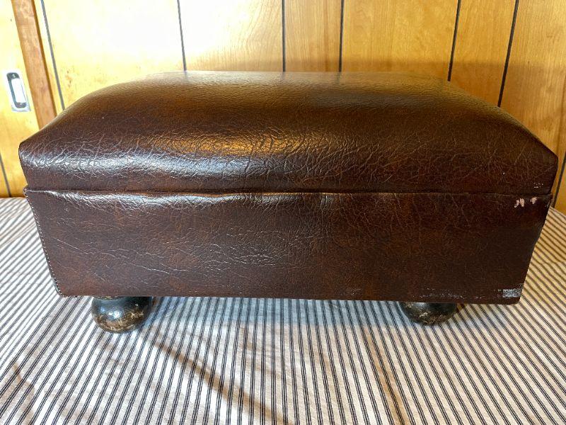 LOT 247 VINTAGE BROWN NAUGAHYDE FOOTSTOOL BALL FEET | EstateSales.org