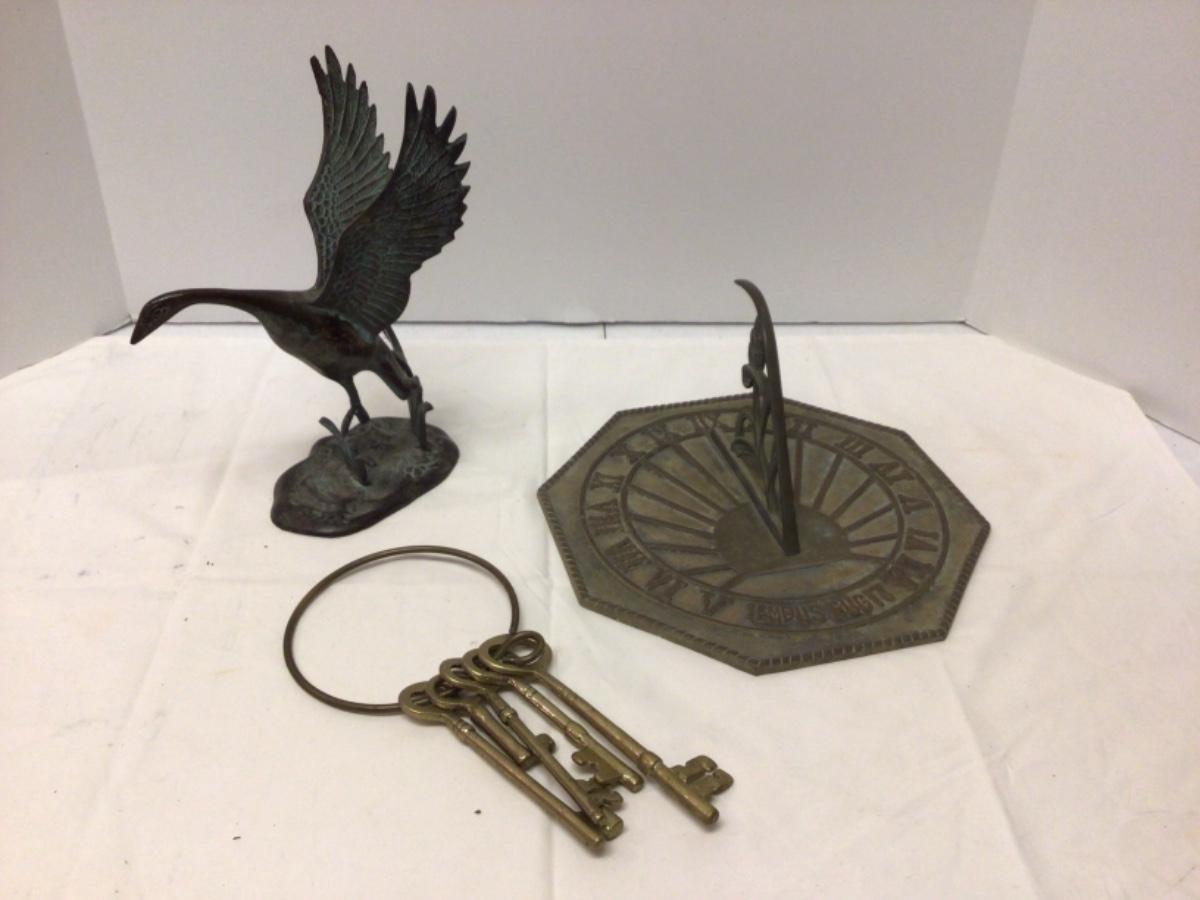 B510 Duck Sculpture ,Sundial, and Keys | EstateSales.org