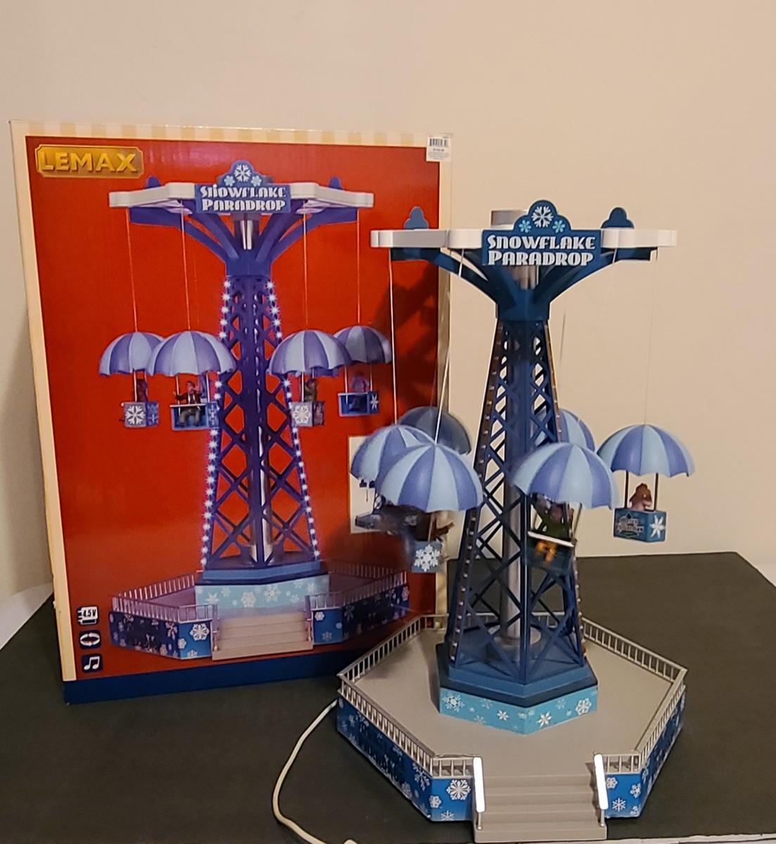 Lot 66: Lemax Snowflake Paradrop | EstateSales.org