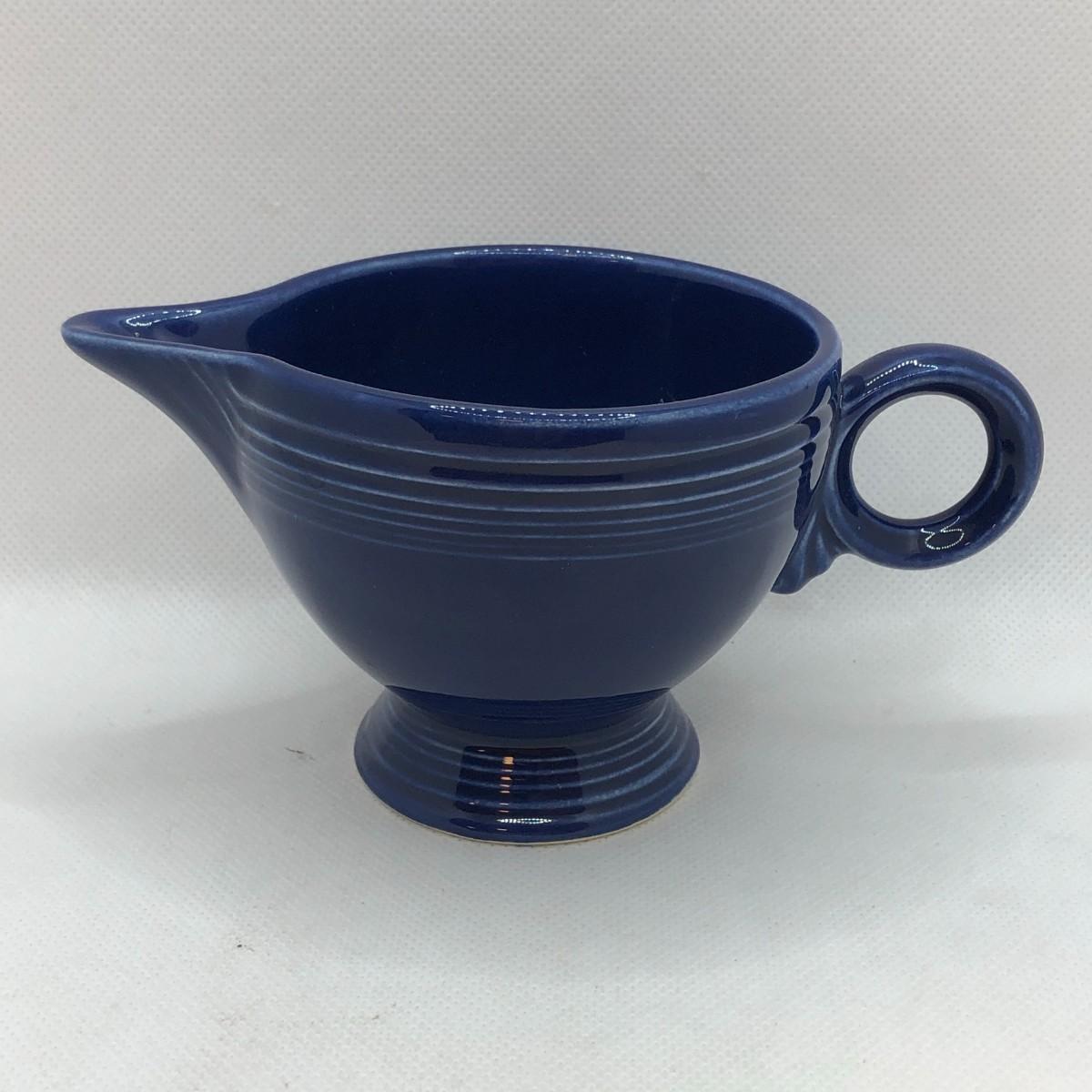Lot 4 - Vintage Fiestaware Creamer Purple | EstateSales.org