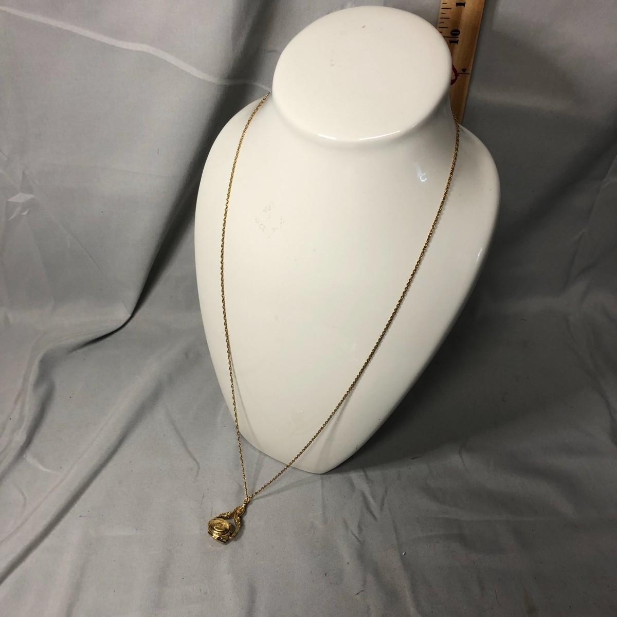 Lot 113 - Gold Tone Triple Picture Locket by 1928 | EstateSales.org