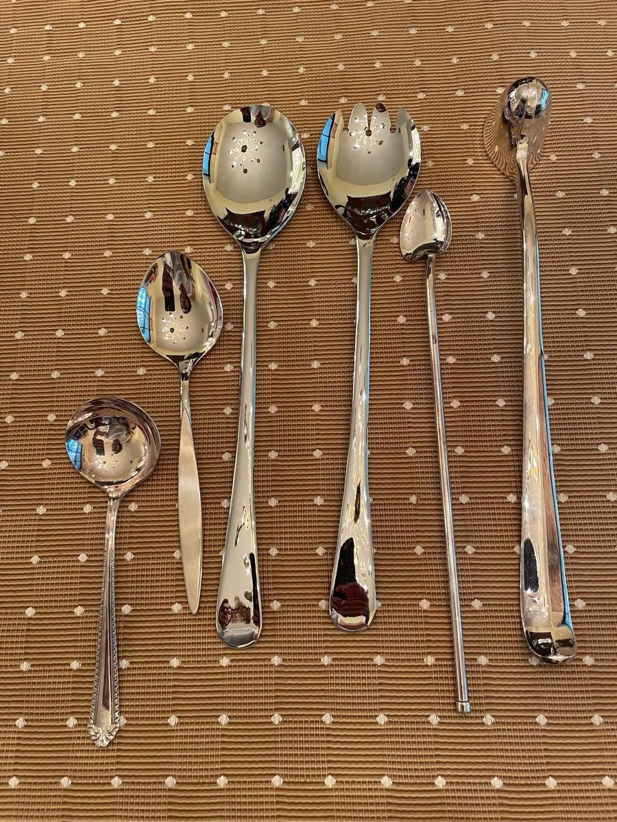 Assorted Spoons and Candle Snuffer | EstateSales.org