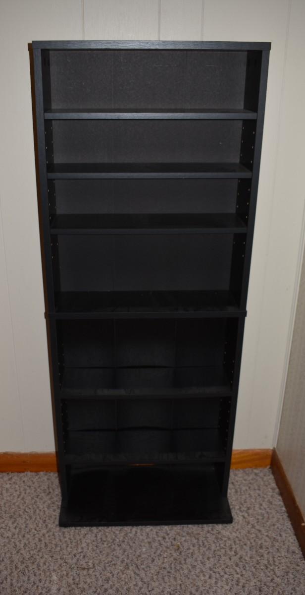 DVD/VHS Stand #169 | EstateSales.org