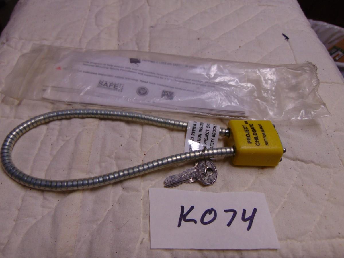 K074 pistol lock | EstateSales.org