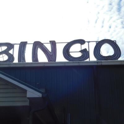 Neon Sign 'BINGO' Attached to Welded Metal Support Rack on Building ...