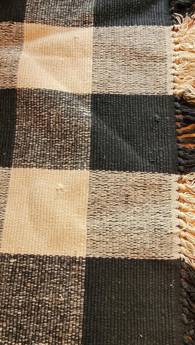 Lot 193: Black and Tan Buffalo Check Woven Rug | EstateSales.org