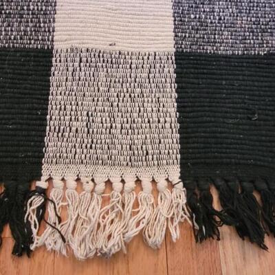 Lot 196: Black and Tan Buffalo Check Woven Rug #2 | EstateSales.org