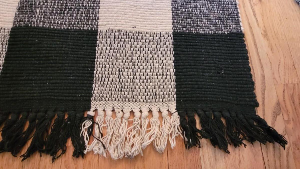 Lot 196: Black and Tan Buffalo Check Woven Rug #2 | EstateSales.org