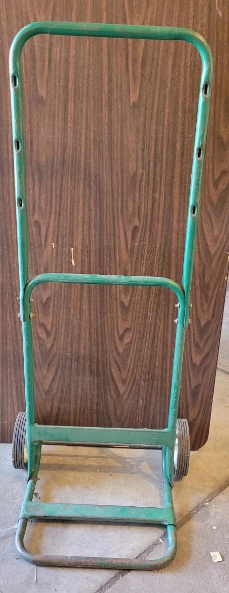 Lot 271: Vintage Small Green Metal Dolly | EstateSales.org