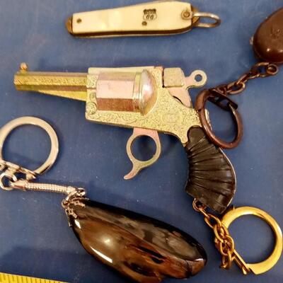 LOT 38 SEVEN OLD KEY CHAINS | EstateSales.org