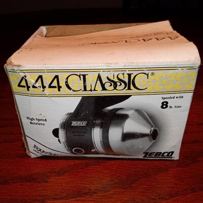 LOT 18 ZEBCO 444 CLASSIC FISHING REEL WITH BOX | EstateSales.org