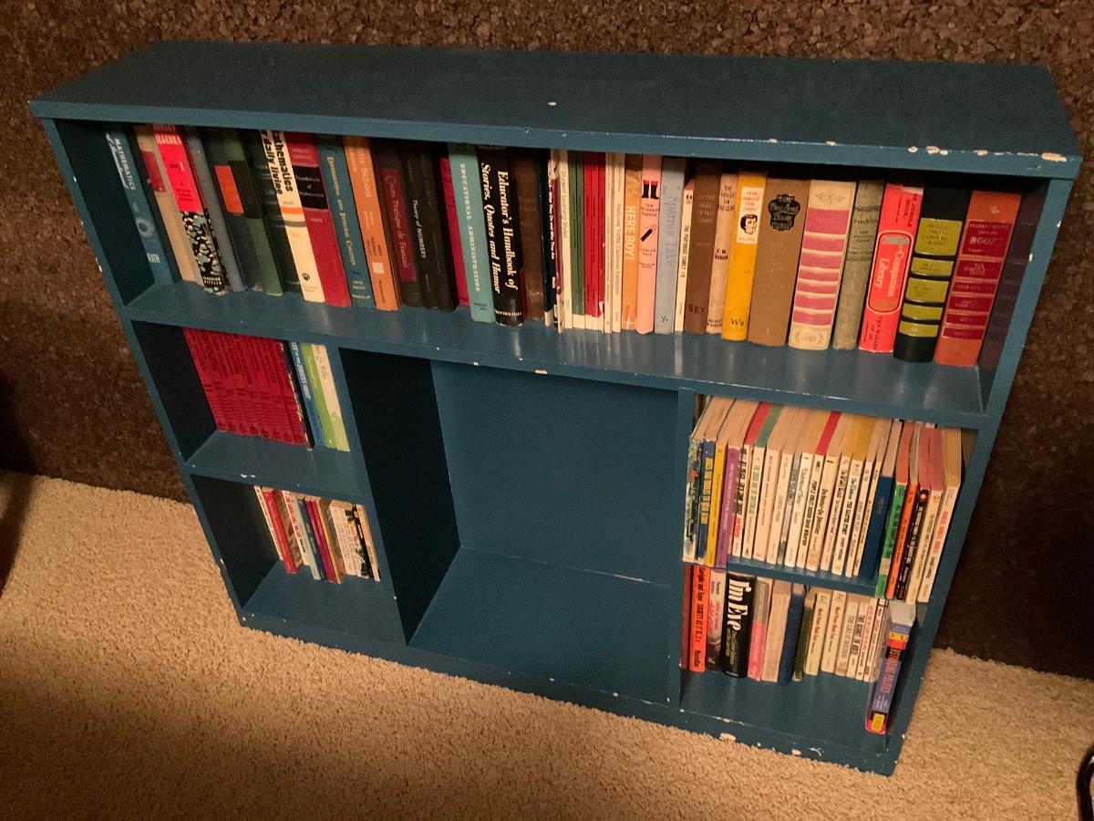 Vintage books and blue book case | EstateSales.org