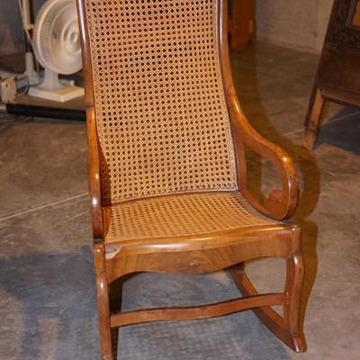 ANTIQUE LINCOLN STYLE CANED ROCKER | EstateSales.org