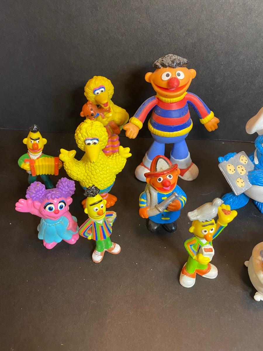 LOT 123: Sesame Street Figurines & Book | EstateSales.org