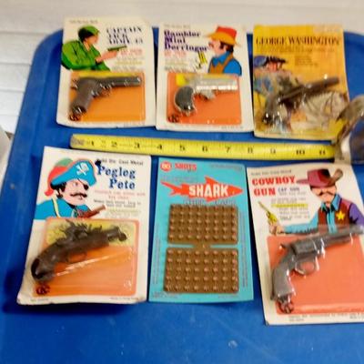 LOT 65 LOT OF VNTAGE CAP GUN KEY CHAINS WITH CAPS | EstateSales.org