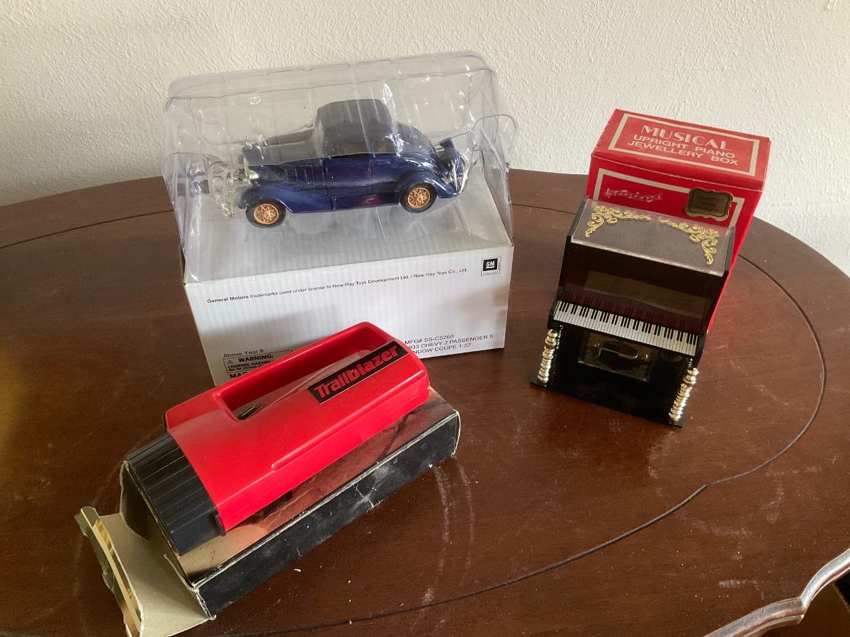 New in box piano jewelry box ,flashlight and 1933 Chevy | EstateSales.org