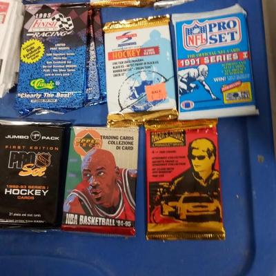 LOT 118 LARGE LOT OF UNOPENED VINTAGE SPORTS CARD PACKS | EstateSales.org
