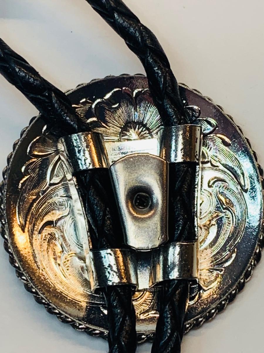 LOT 104: Silver & Gold Plated Belt Buckles & Bolo Tie | EstateSales.org