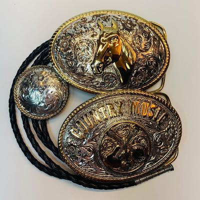 LOT 104: Silver & Gold Plated Belt Buckles & Bolo Tie | EstateSales.org