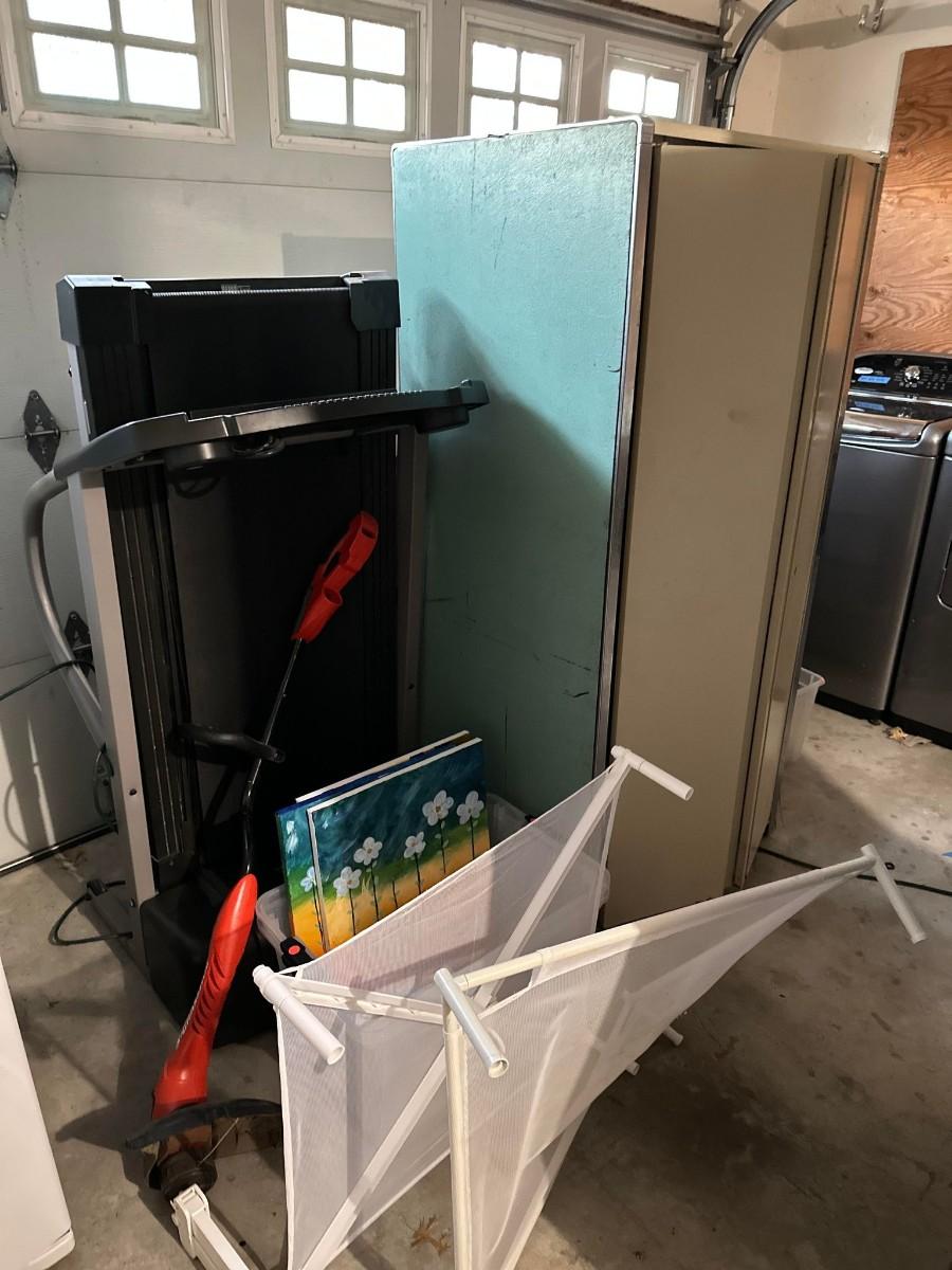 Lot 15: Treadmill, cabinet and more | EstateSales.org