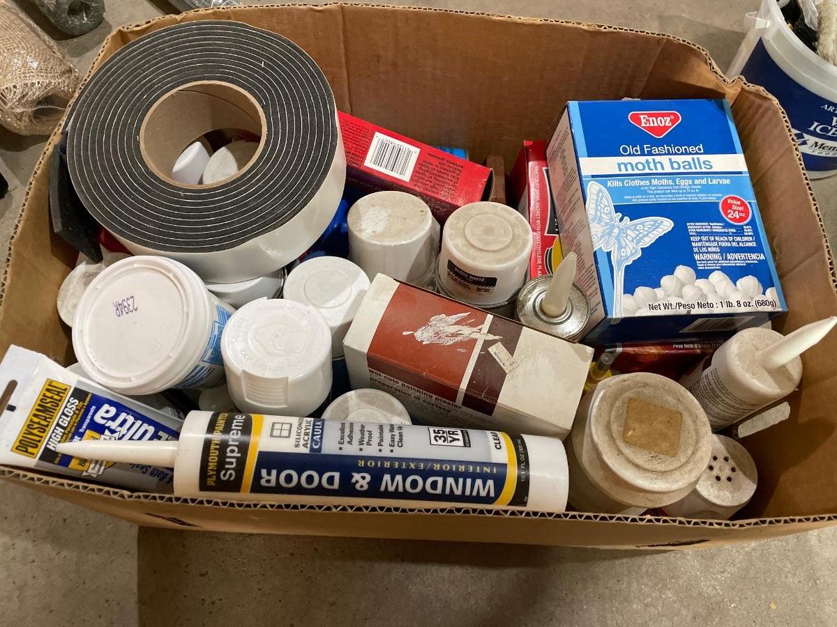 Box of caulk weatherstrip spray paint ect | EstateSales.org