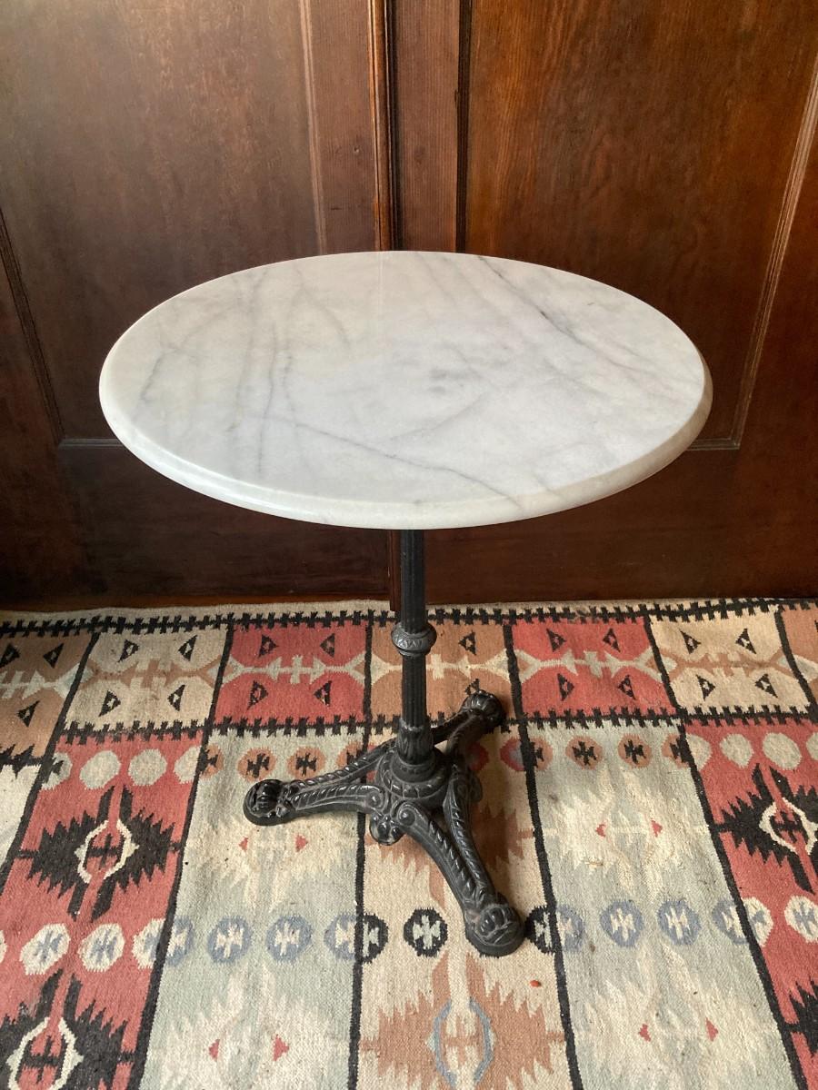 Marble top cafe table with a cast iron base | EstateSales.org