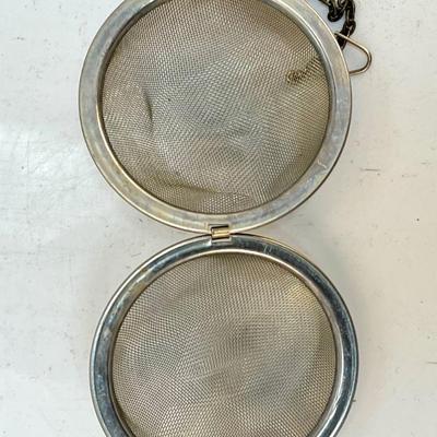 Round metal tea strainer | EstateSales.org