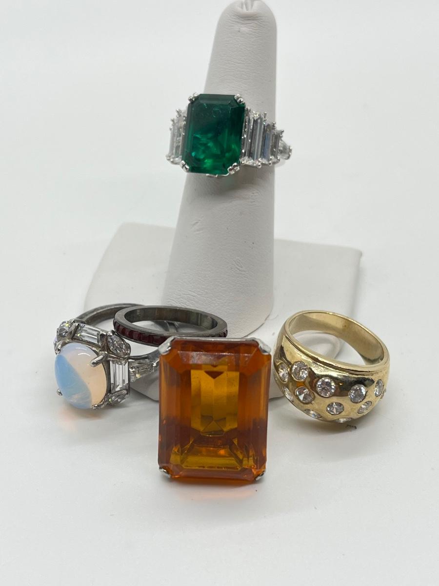 LOT 126: Five Costume Jewelry Rings - Various Sizes | EstateSales.org