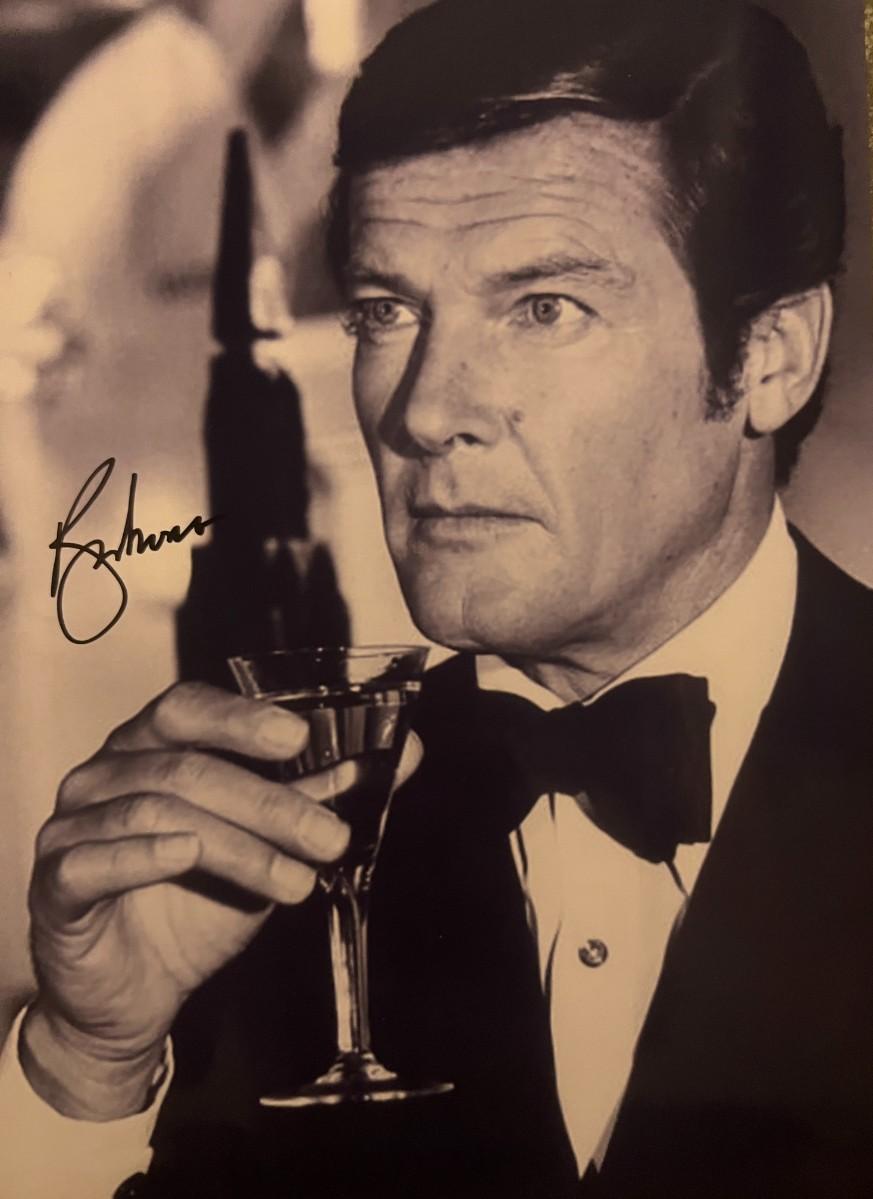 James Bond Roger Moore signed photo | EstateSales.org