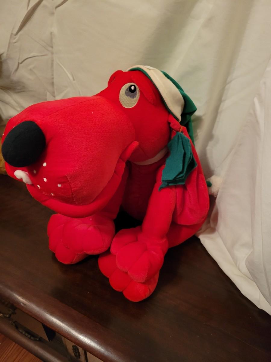 Large red Dog (Clifford?) wearing holiday hat | EstateSales.org