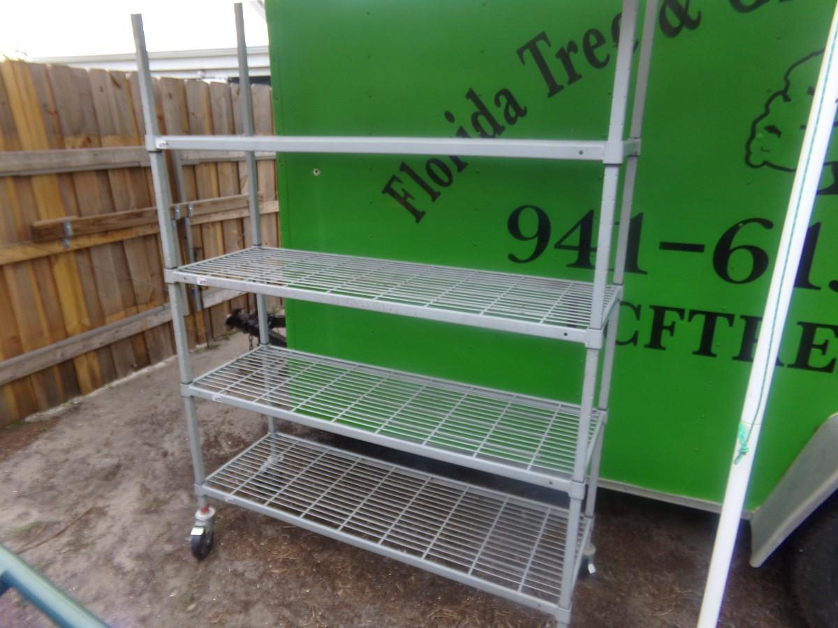 Amco Metal Backers Rack with Large Locking Wheels. | EstateSales.org