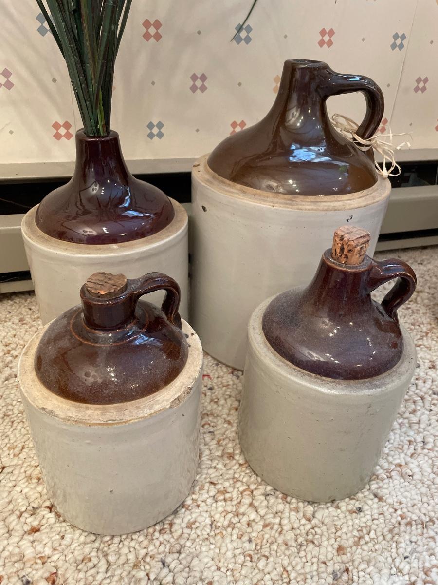 Set of 4 brown top jugs | EstateSales.org