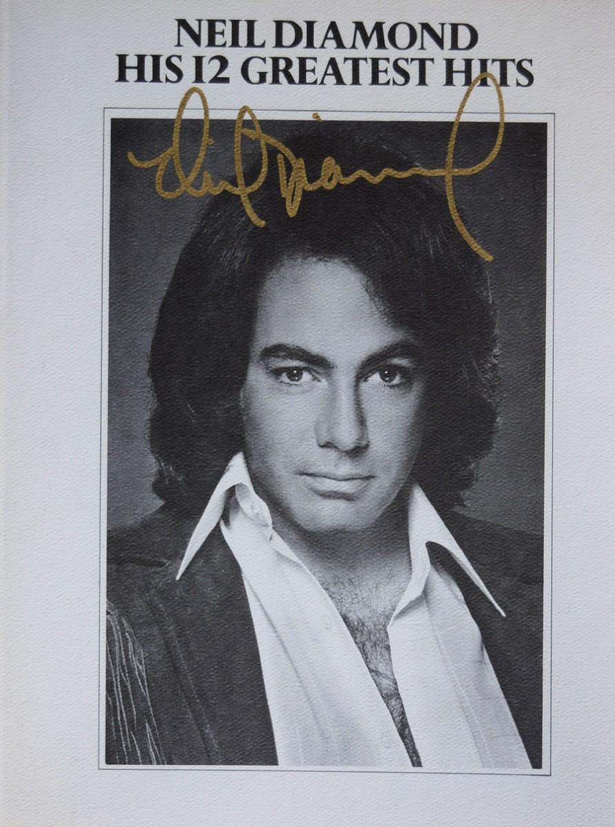 Neil Diamond signed music book | EstateSales.org