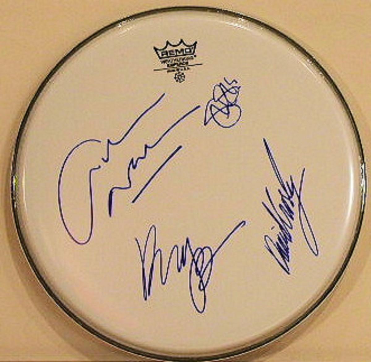 Crosby, Stills, Nash & Young signed drum head | EstateSales.org