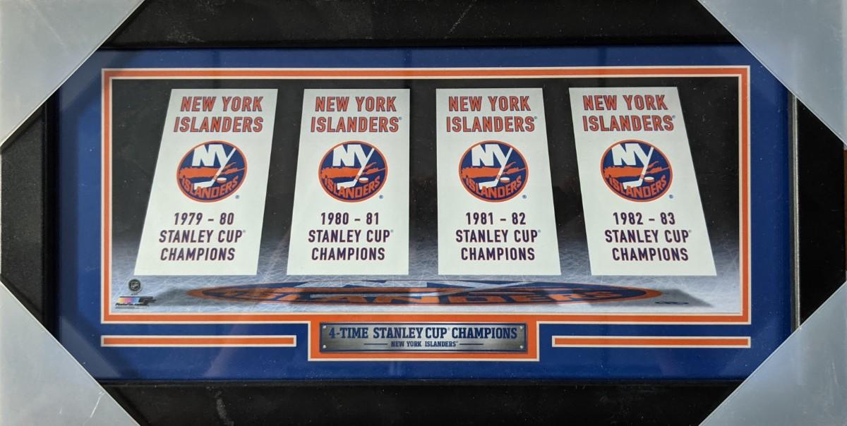 N.Y. Islanders Stanley Cup Banners Framed Photo | EstateSales.org
