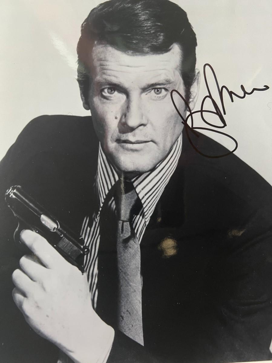 James Bond Roger Moore signed photo. GFA authenticated | EstateSales.org