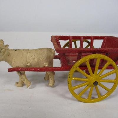 Vintage Cast Iron Ox Drawn Cart | EstateSales.org
