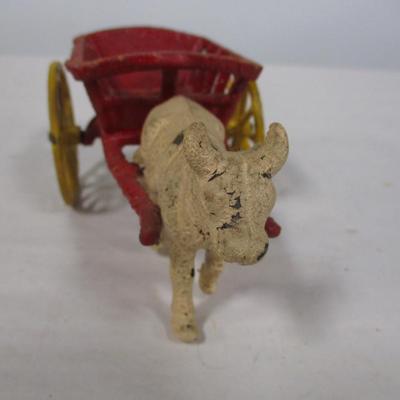 Vintage Cast Iron Ox Drawn Cart | EstateSales.org
